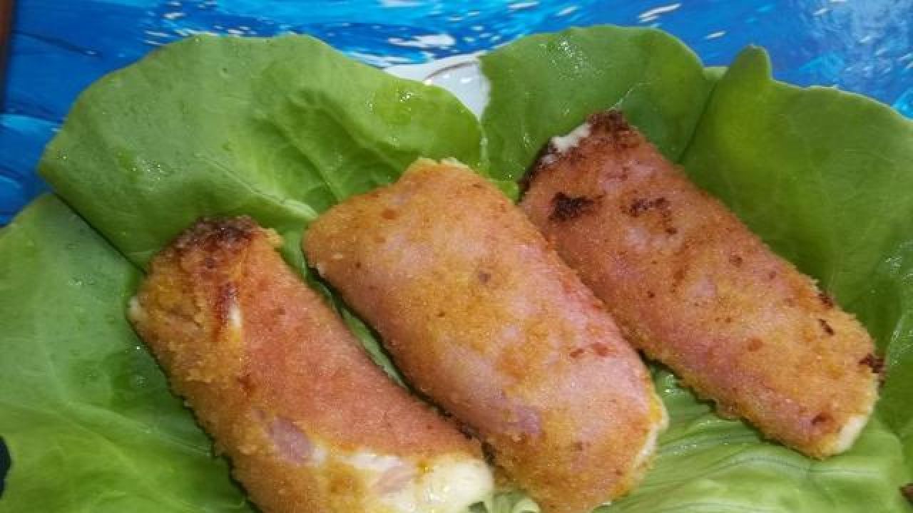 Przepis - Zawijasy z parówką przepis - Gotujmy.pl